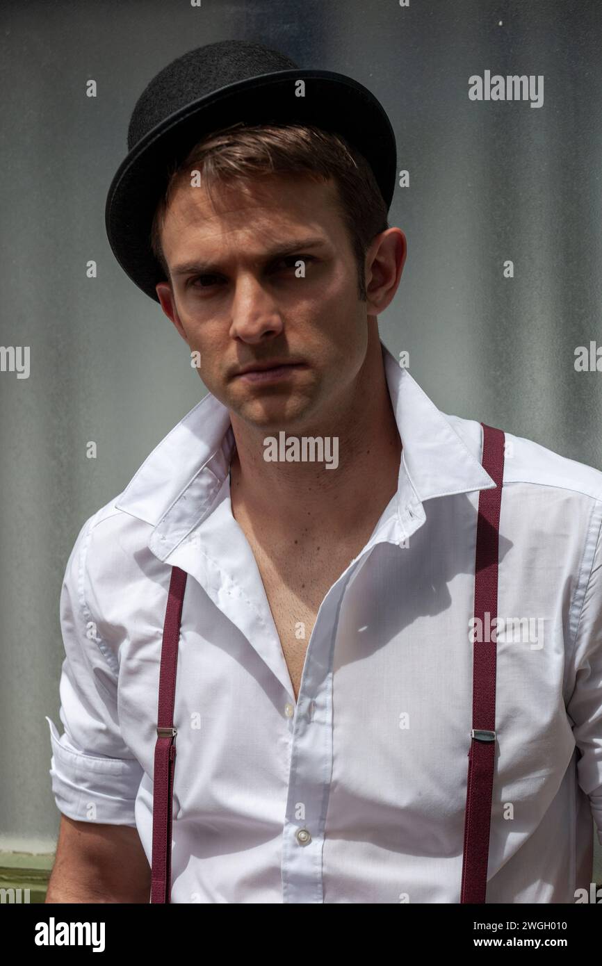 Man wearing bowler hat looking at viewer vertical Stock Photo - Alamy