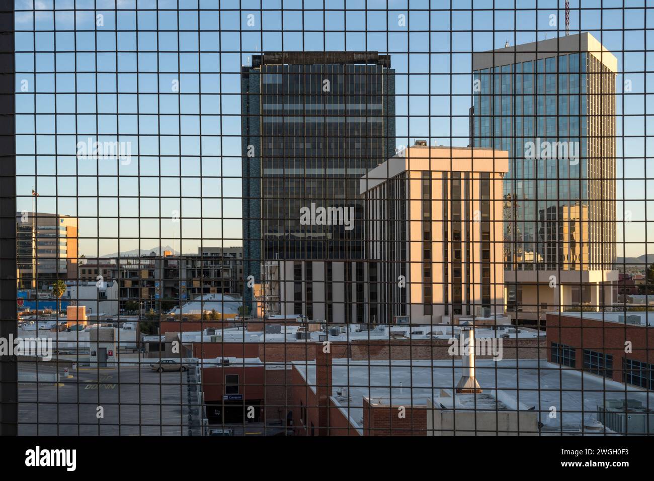 Grid pattern overlayed on tall buildings in background Stock Photo - Alamy