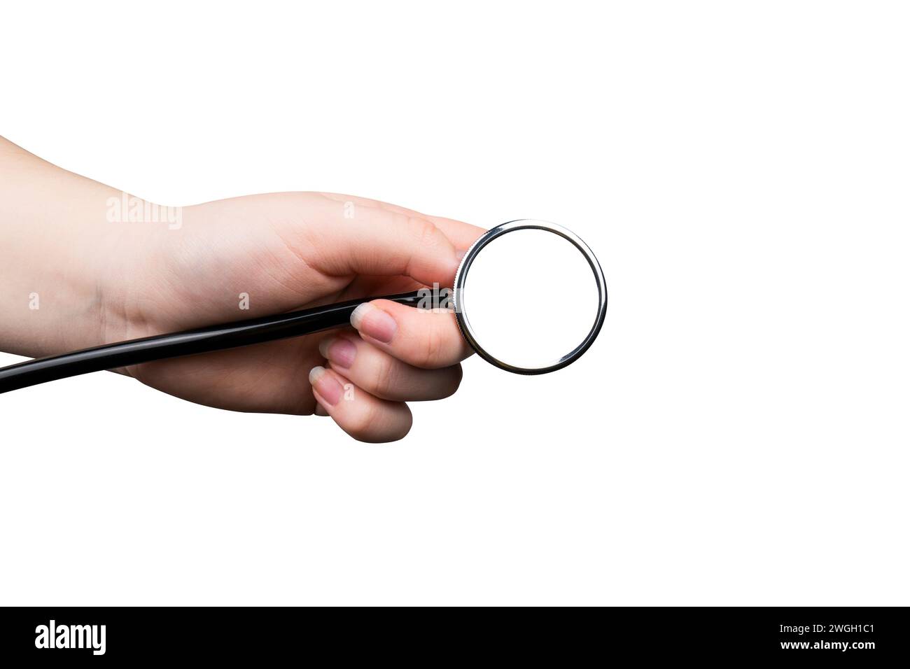 The head of a medical stethoscope in a hand, close-up, isolated on a ...