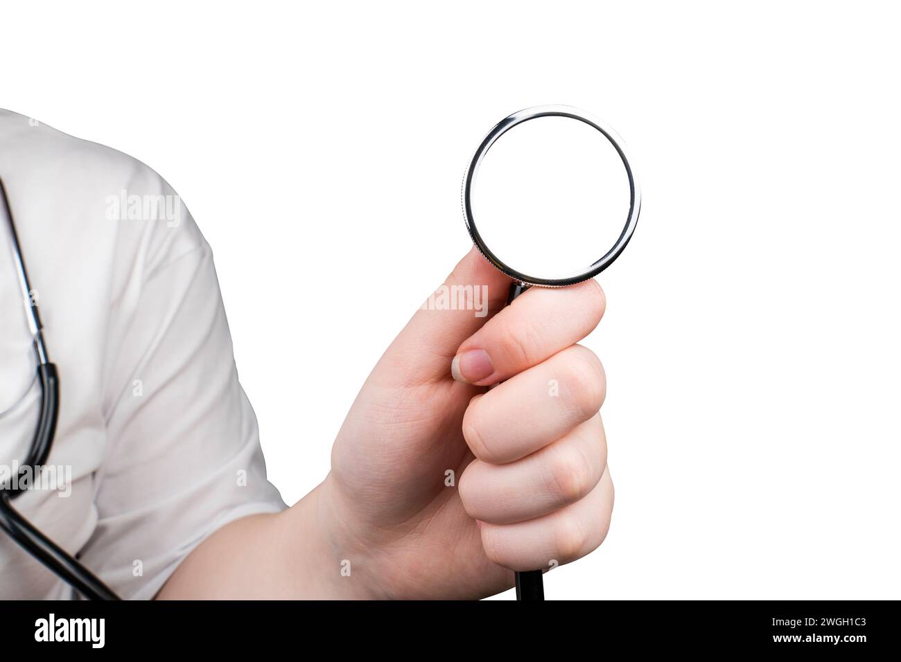 The head of a medical stethoscope in a hand, close-up, isolated on a ...