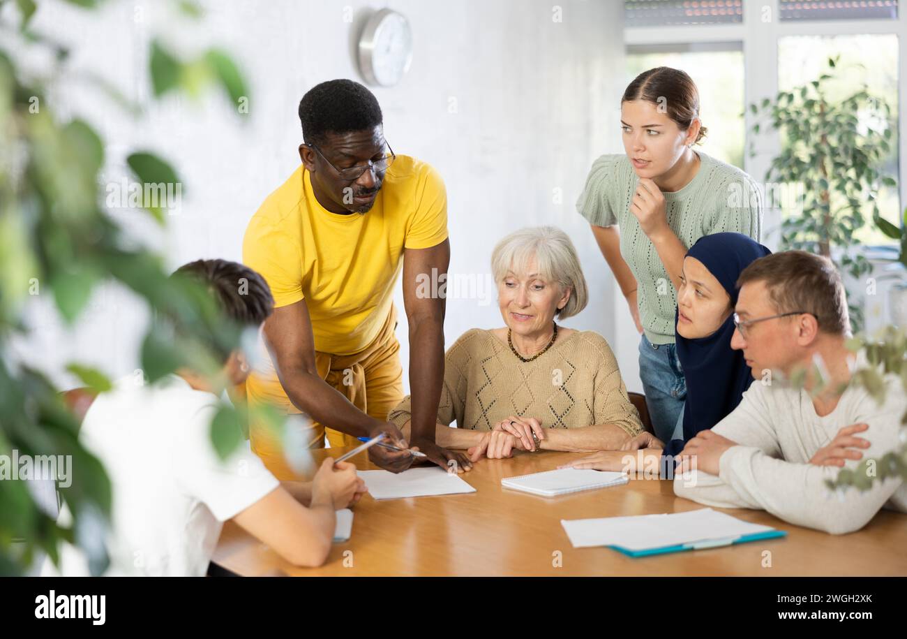 Men and women different ages discussion during business course in ...