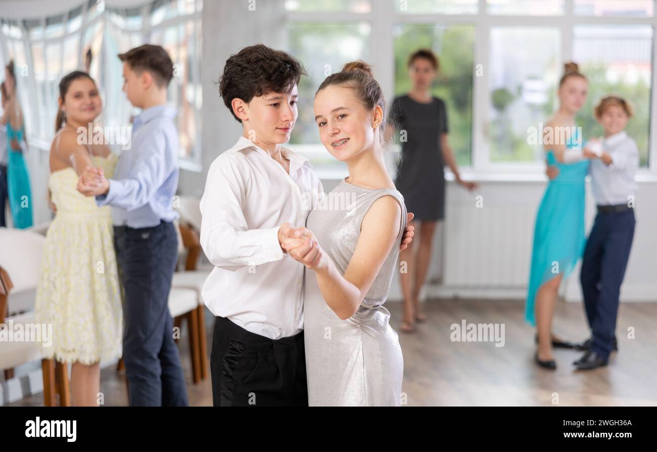 Boy and girl dancing waltz in studio Stock Photo - Alamy