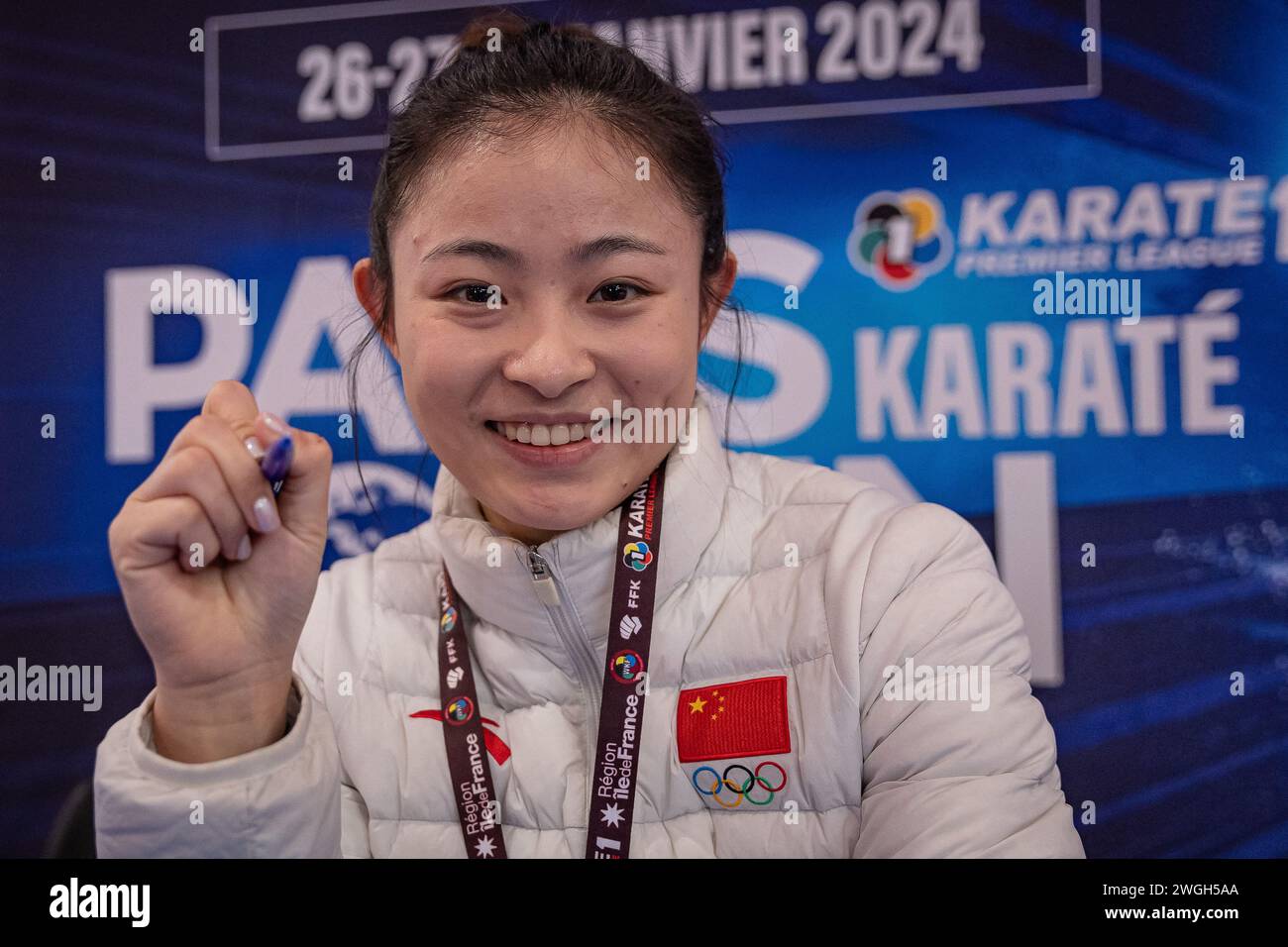 Li Gong from China signs autographs during the Paris Open Karate ...