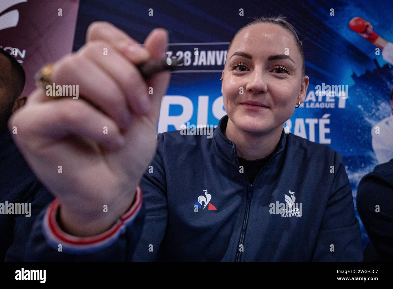 Alizee Agier from France signs autographs during the Paris Open Karate ...