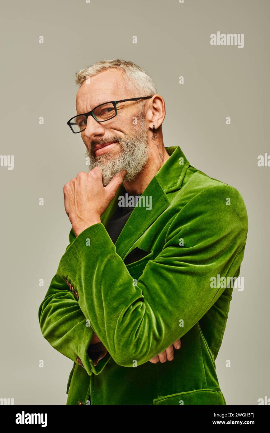 good looking mature funky male model in fashionable attire with glasses ...