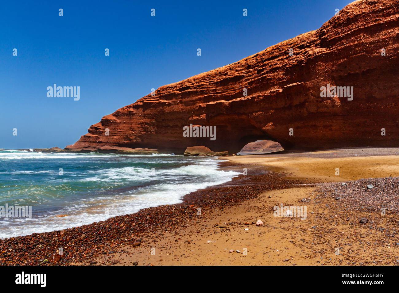 Spectacular natural red arch on atlantic ocean coast, Legzira ( or ...