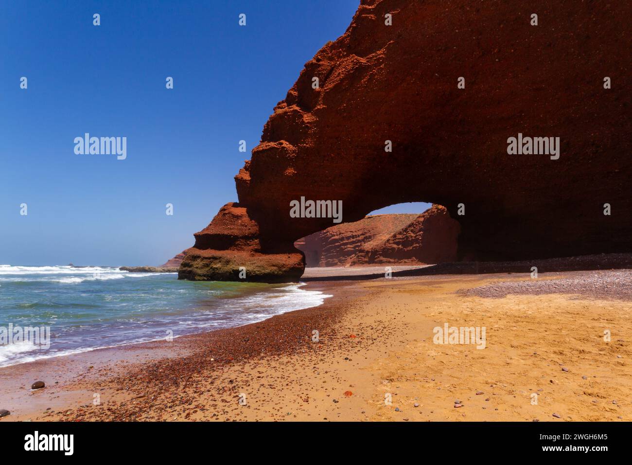 Spectacular natural red arch on atlantic ocean coast, Legzira ( or ...