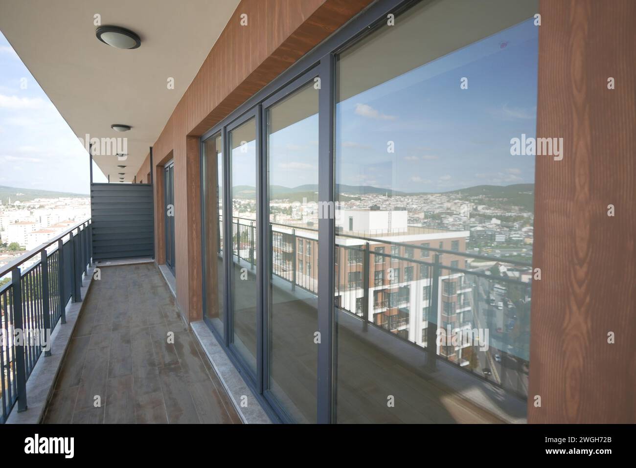 Modern front window with thin curtains and house walls from the outside ...