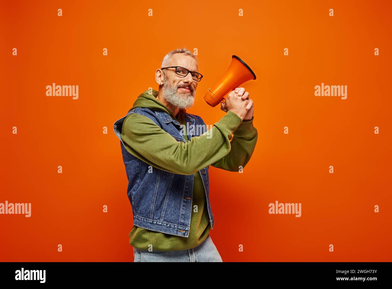 funky cheerful mature male model with beard and glasses posing with ...