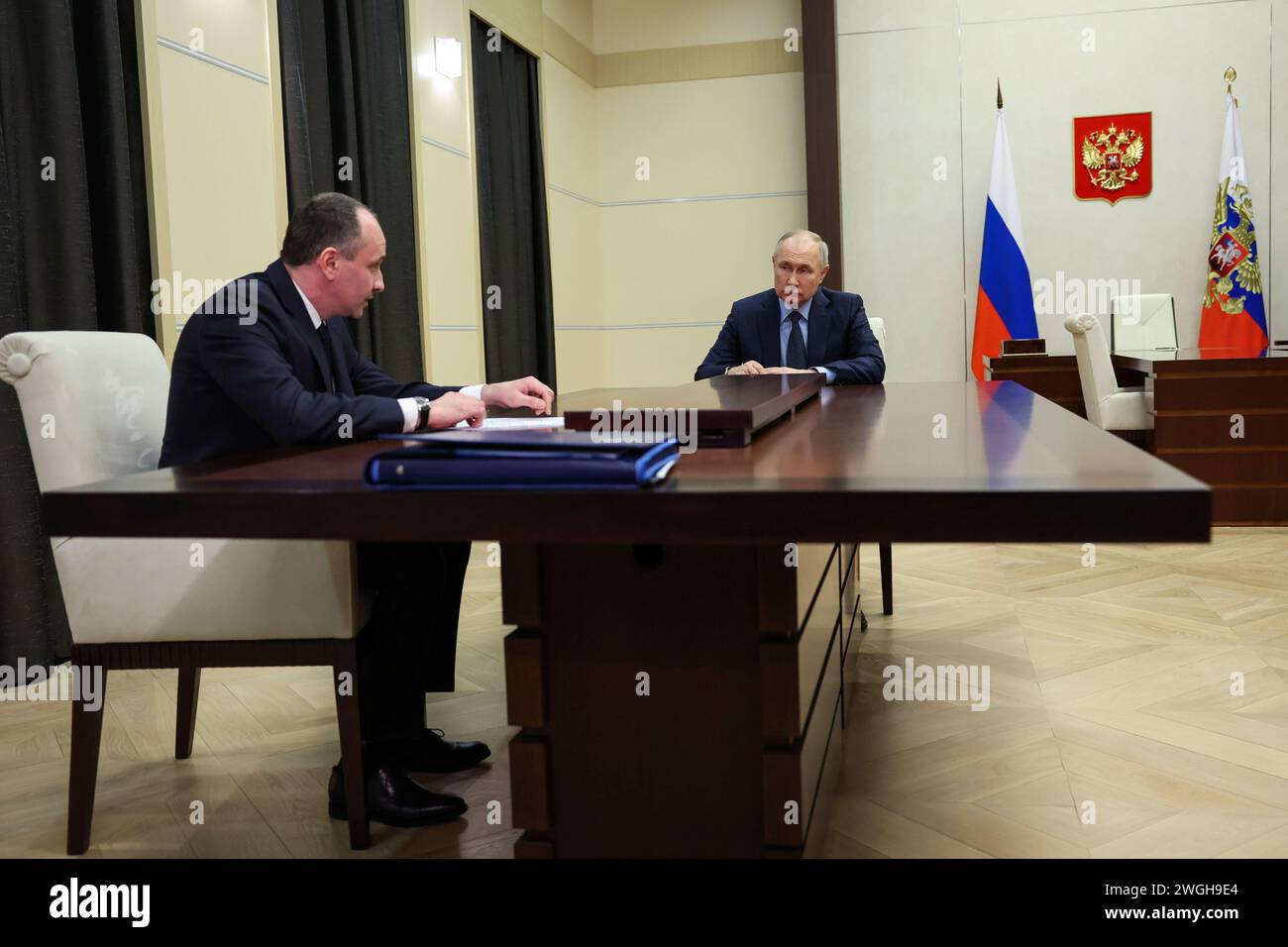 Russian President Vladimir Putin, right, listens to Boris Kovalchuk ...