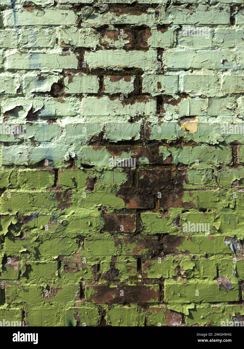green brick wall with old paint Stock Photo - Alamy