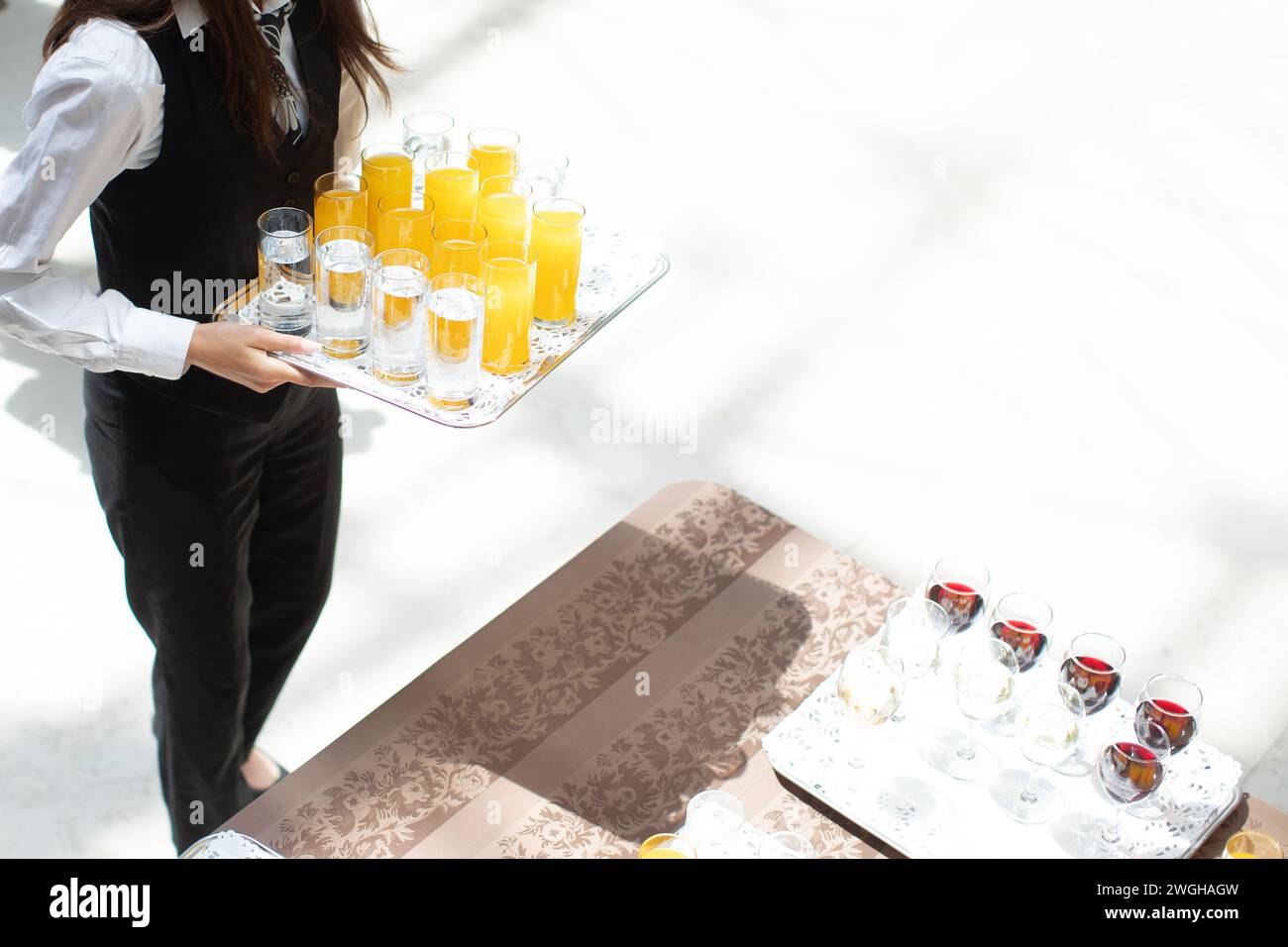 waitress serving soft drinks at party Stock Photo - Alamy