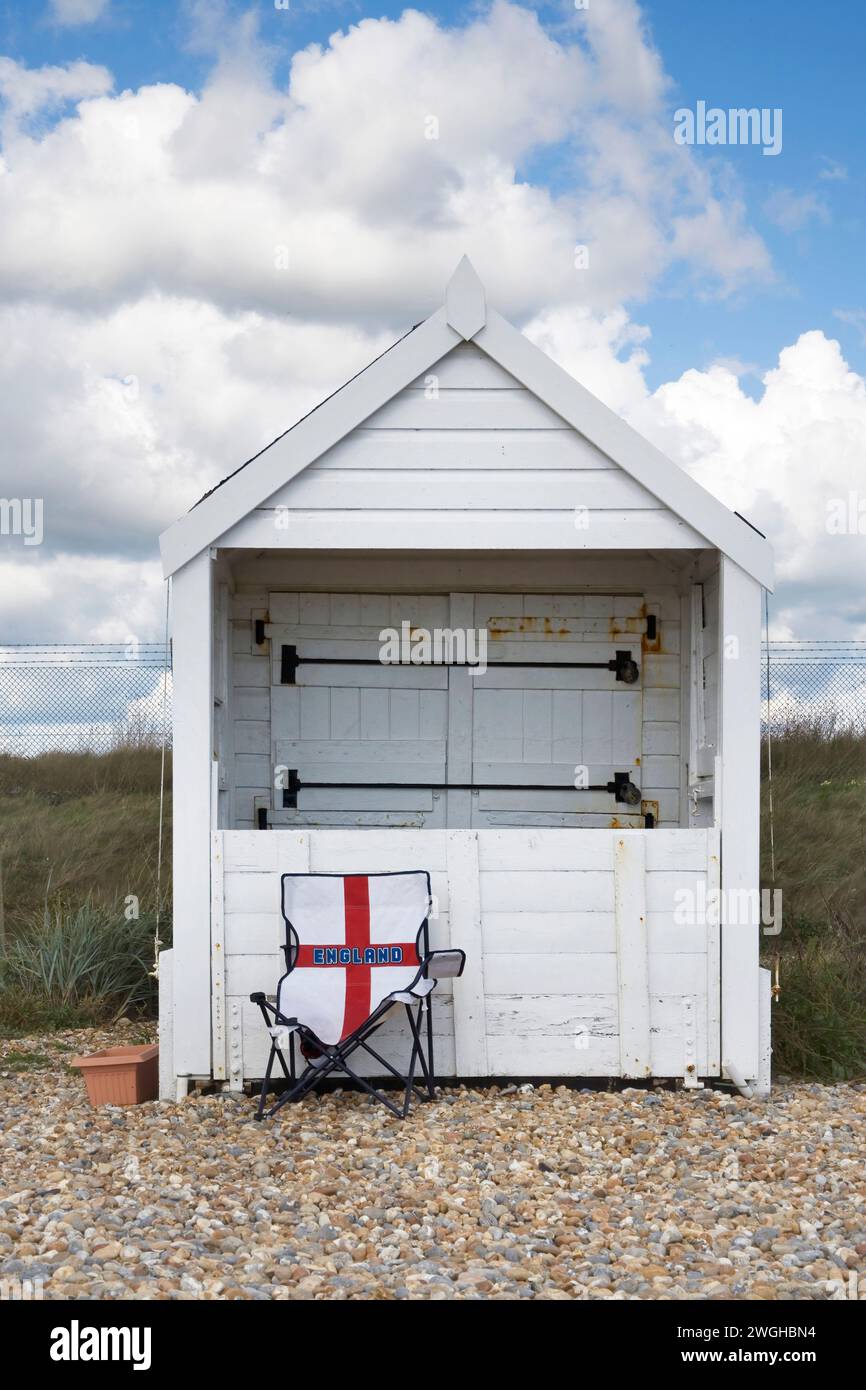 beach huts and chair at Normans bay, east sussex Stock Photo - Alamy