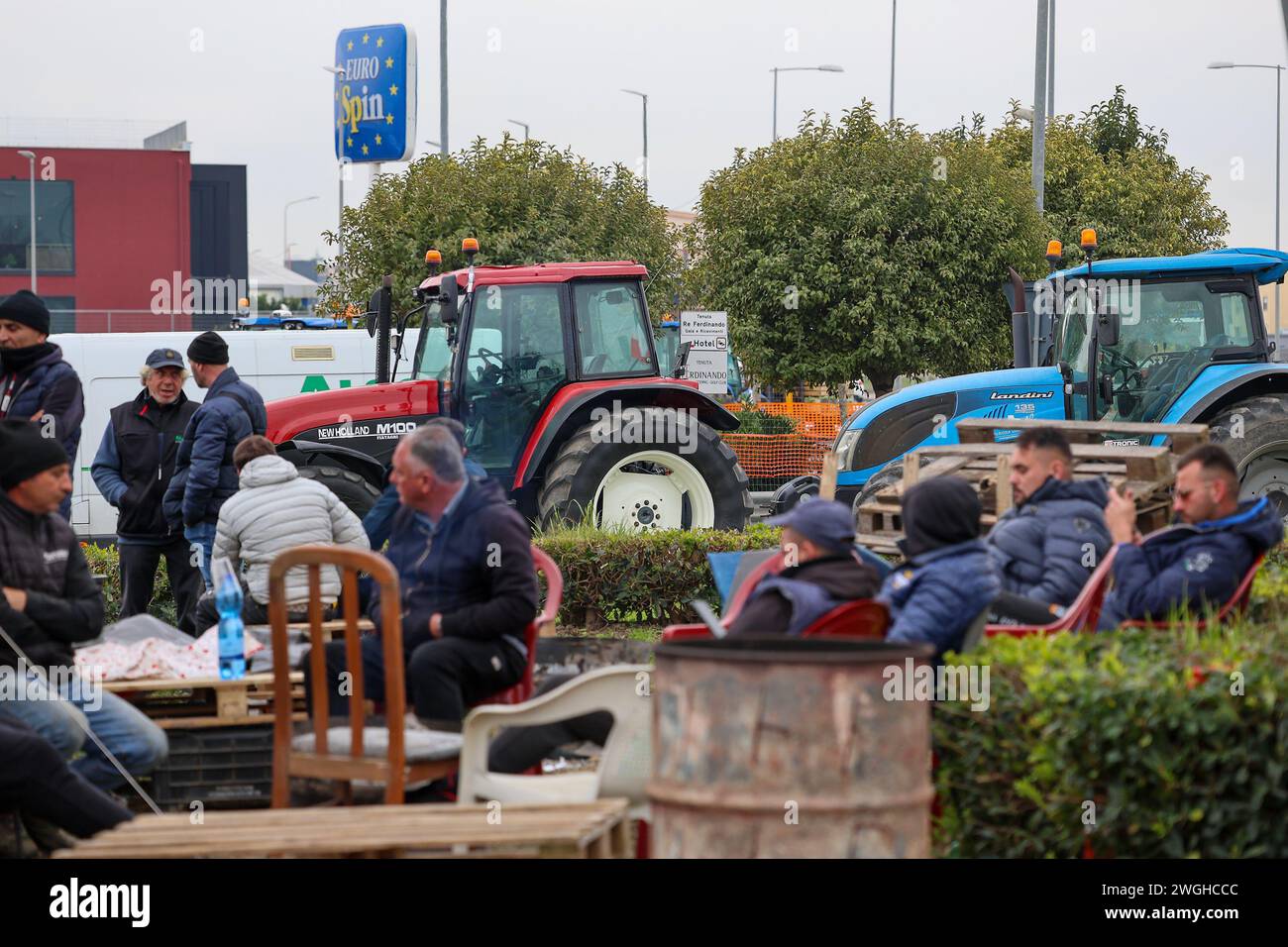 Farmers sit-in with their tractors during the demonstration to protest ...