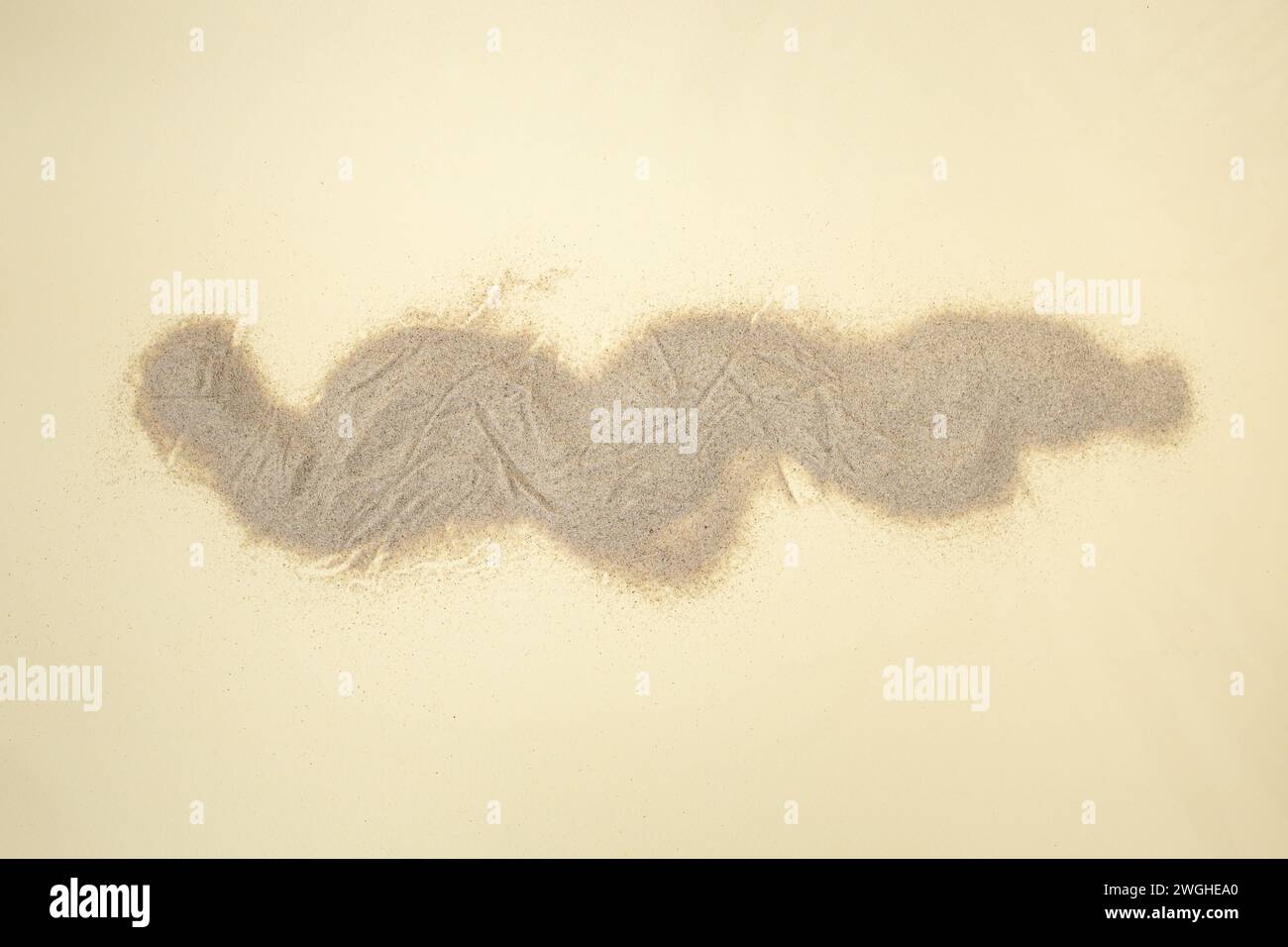Desert sand pile, dune backdrop on cream background abstract soft focus ...