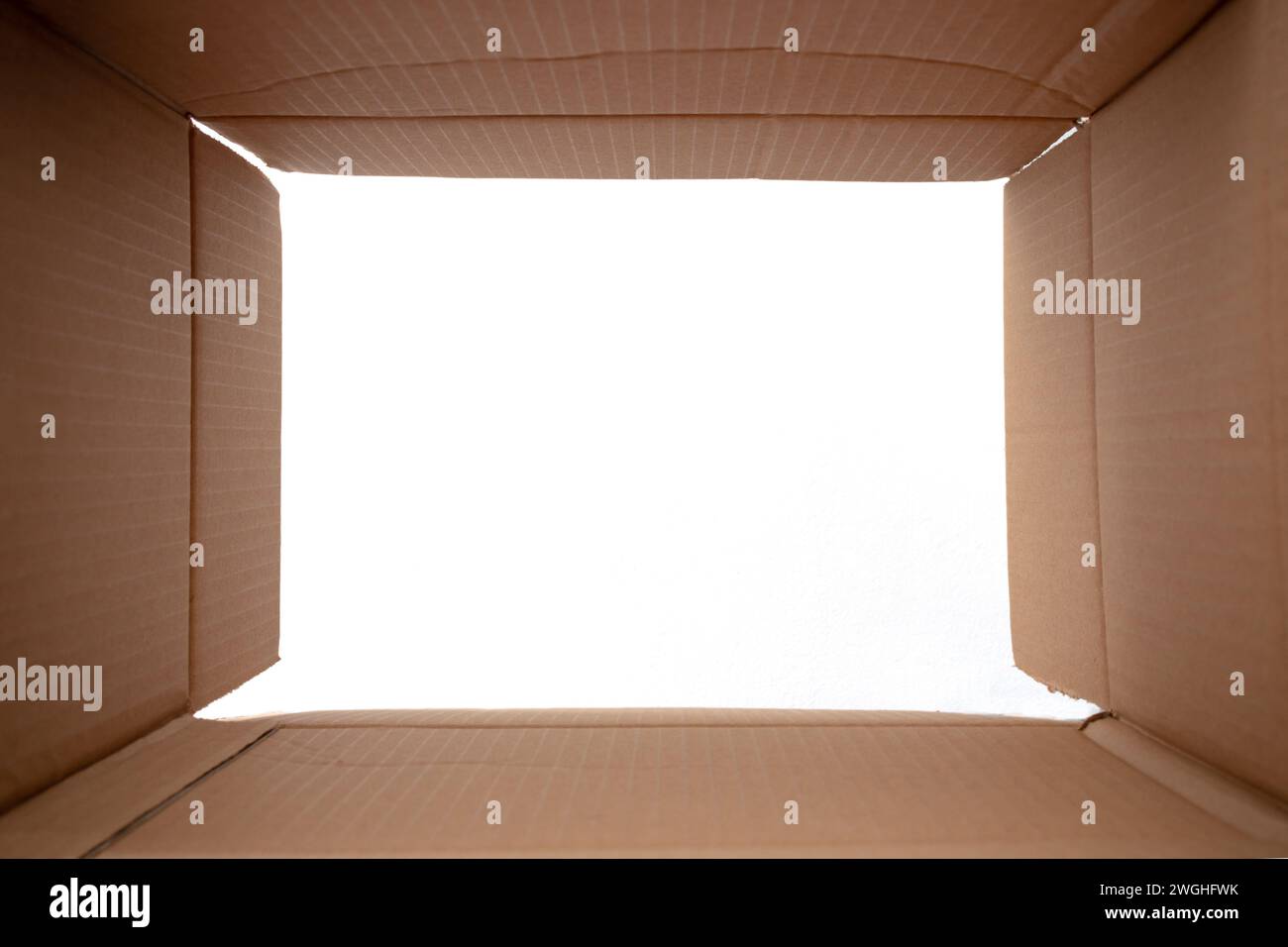 Opened cardboard box shot from inside with white space Stock Photo - Alamy