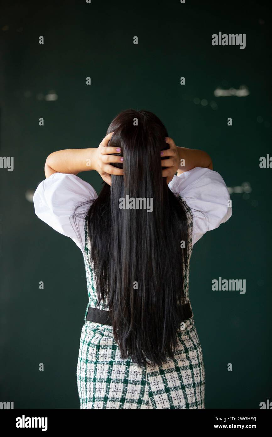 Rear view stressed woman head in hands Stock Photo - Alamy