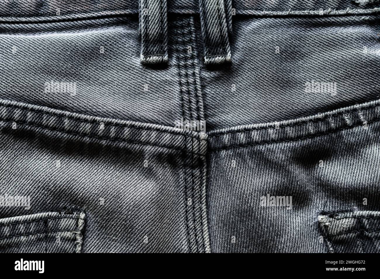 Black denim jeans closeup fabric texture Stock Photo - Alamy