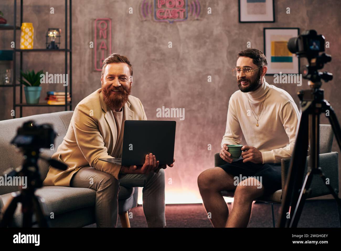 cheerful handsome men in fashionable attires with coffee and laptop ...