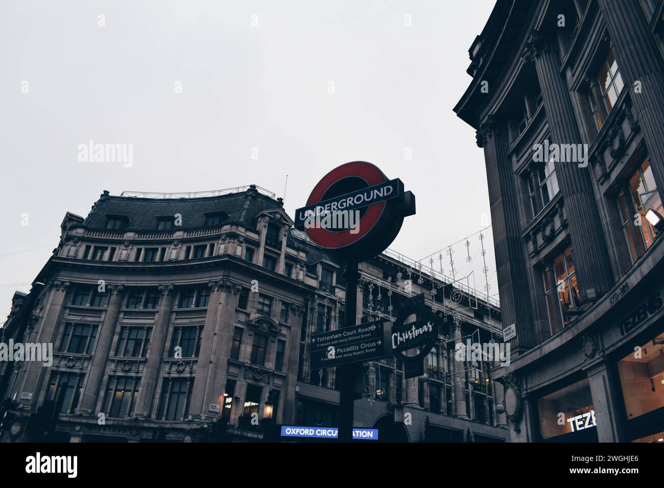 Typical subway pole with buildings in the background in London, England ...