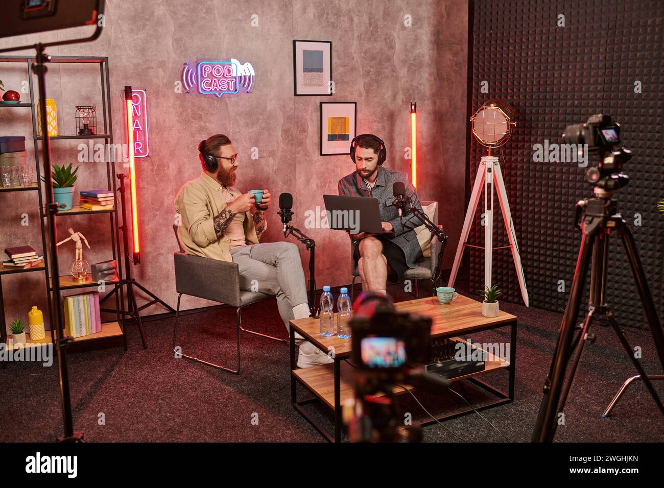 good looking bearded men with headphones drinking coffee and talking ...