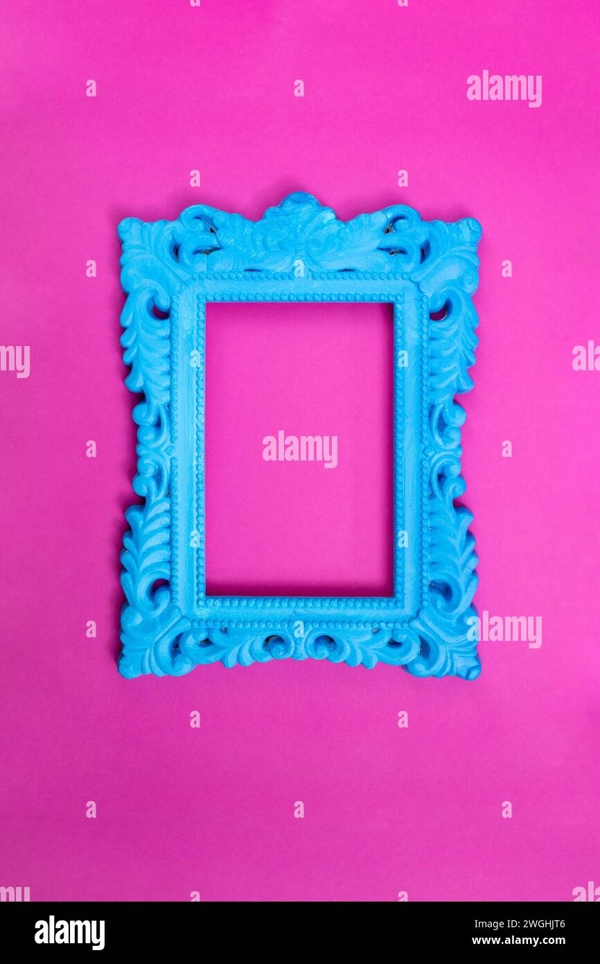 Blue painted baroque frame on magenta background Stock Photo - Alamy