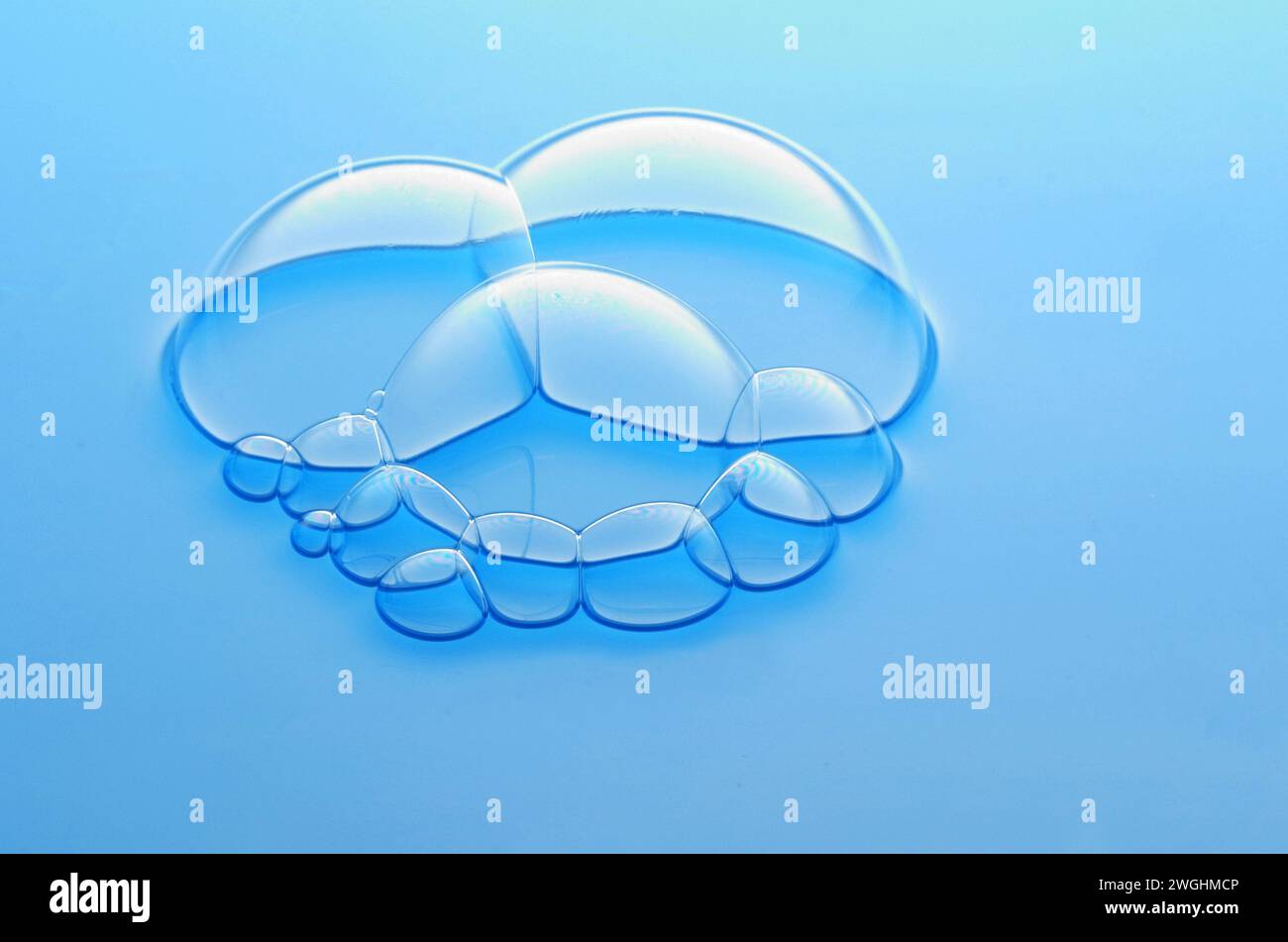 large and small soap bubbles gather on the surface of the water Stock ...