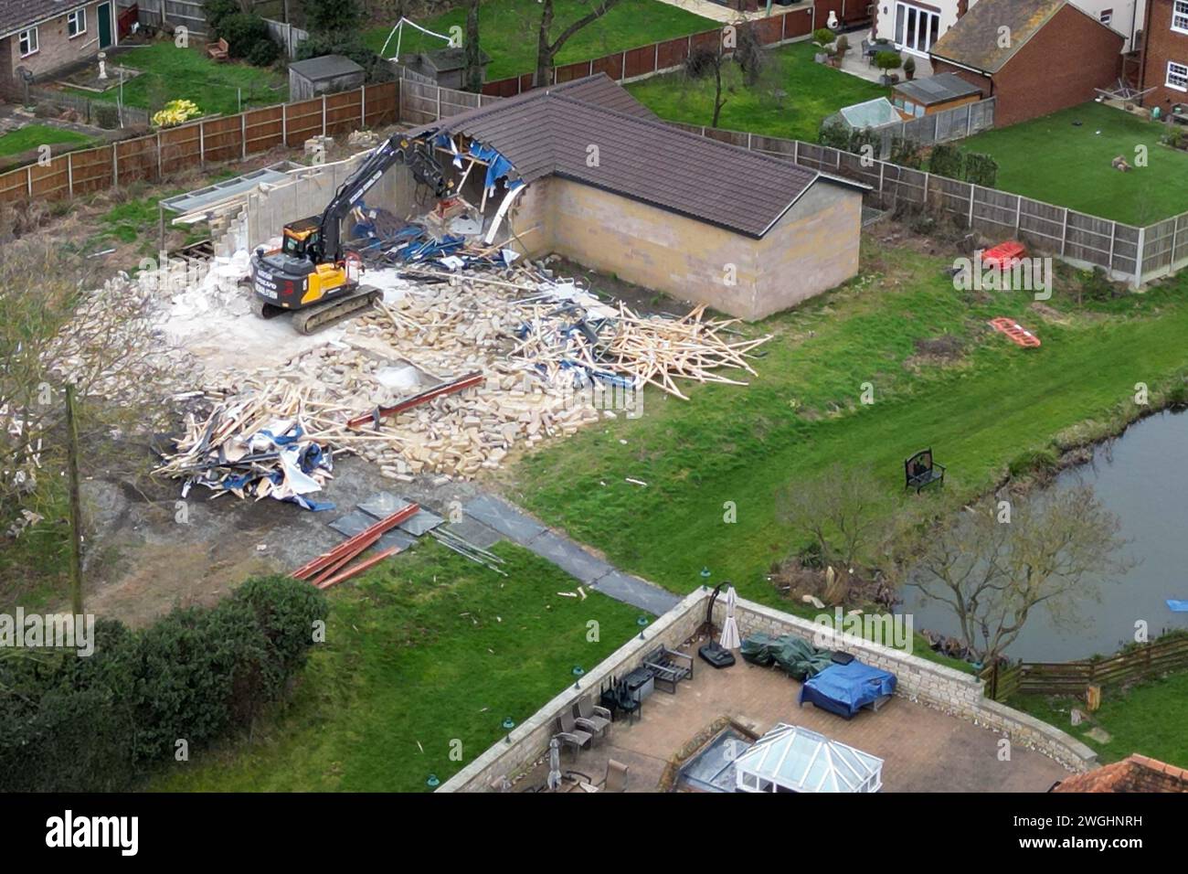 Work continues to demolish an unauthorised spa pool block at the home ...
