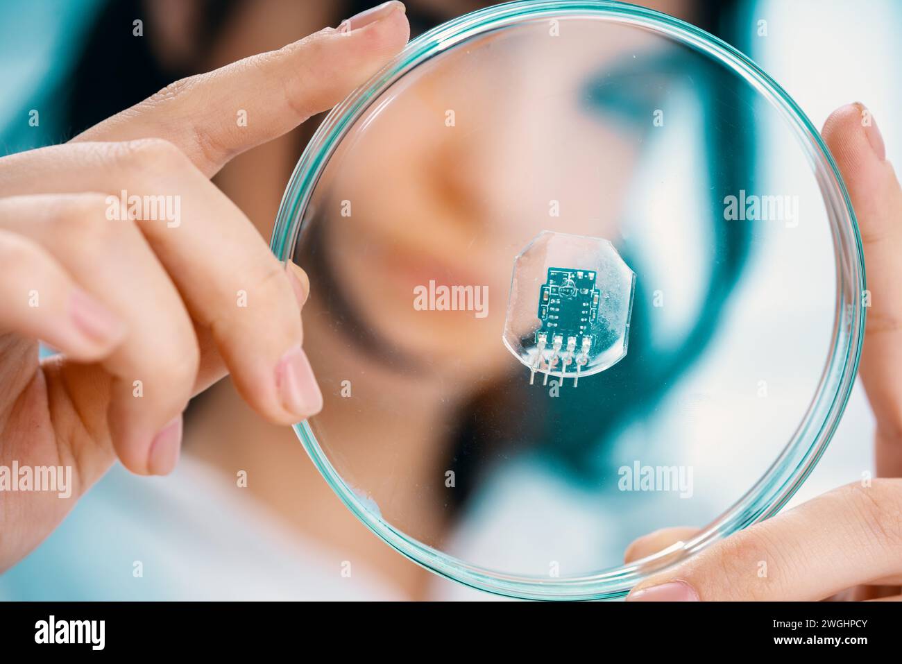 woman in laboratory holding electronic implant Stock Photo - Alamy