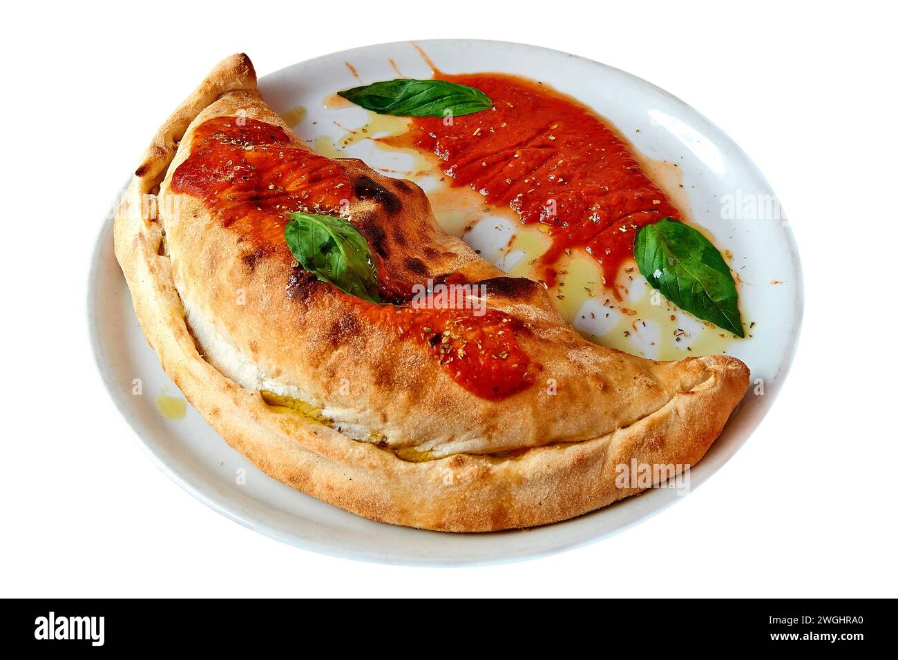 Plate with a Pizza Calzone isolated on white background Stock Photo - Alamy