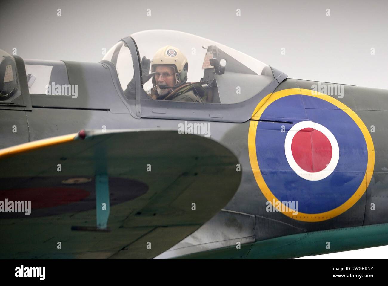 102-year-old Jack Hemmings AFC waves as he flies a Spitfire plane to ...