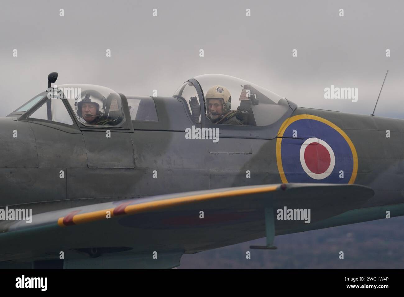 102-year-old Jack Hemmings AFC 9right) waves as he flies a Spitfire ...