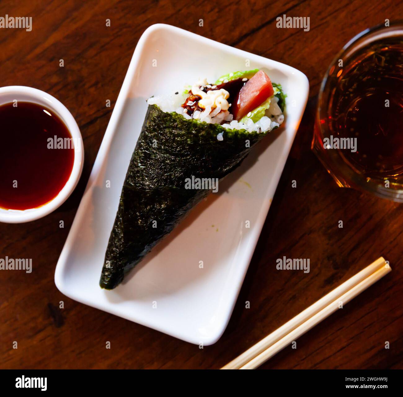 Rolled temaki sushi. Traditional japanese cuisine Stock Photo - Alamy