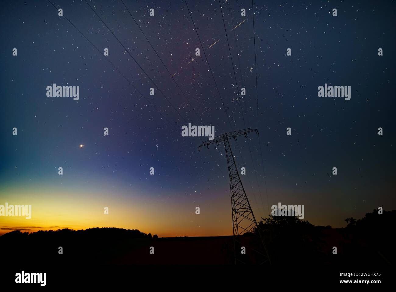 high-voltage power transmission line mast against the background of the ...