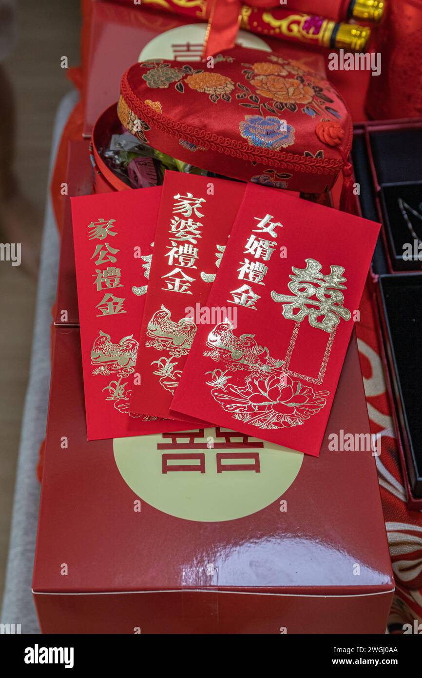 Bride's dowry, red packets and a box of cakes Stock Photo - Alamy