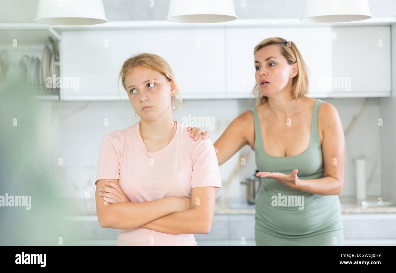 Angry mother yells at teenage girl sad daughter Stock Photo - Alamy