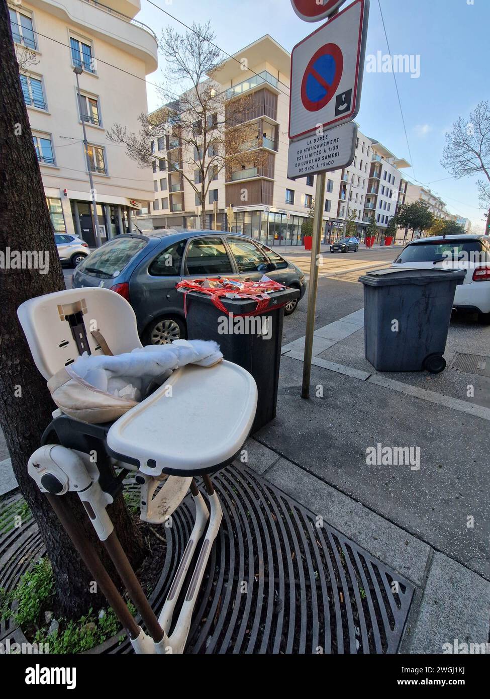 Bulky objects and badly sorted garbages in a can, street view, Bron ...
