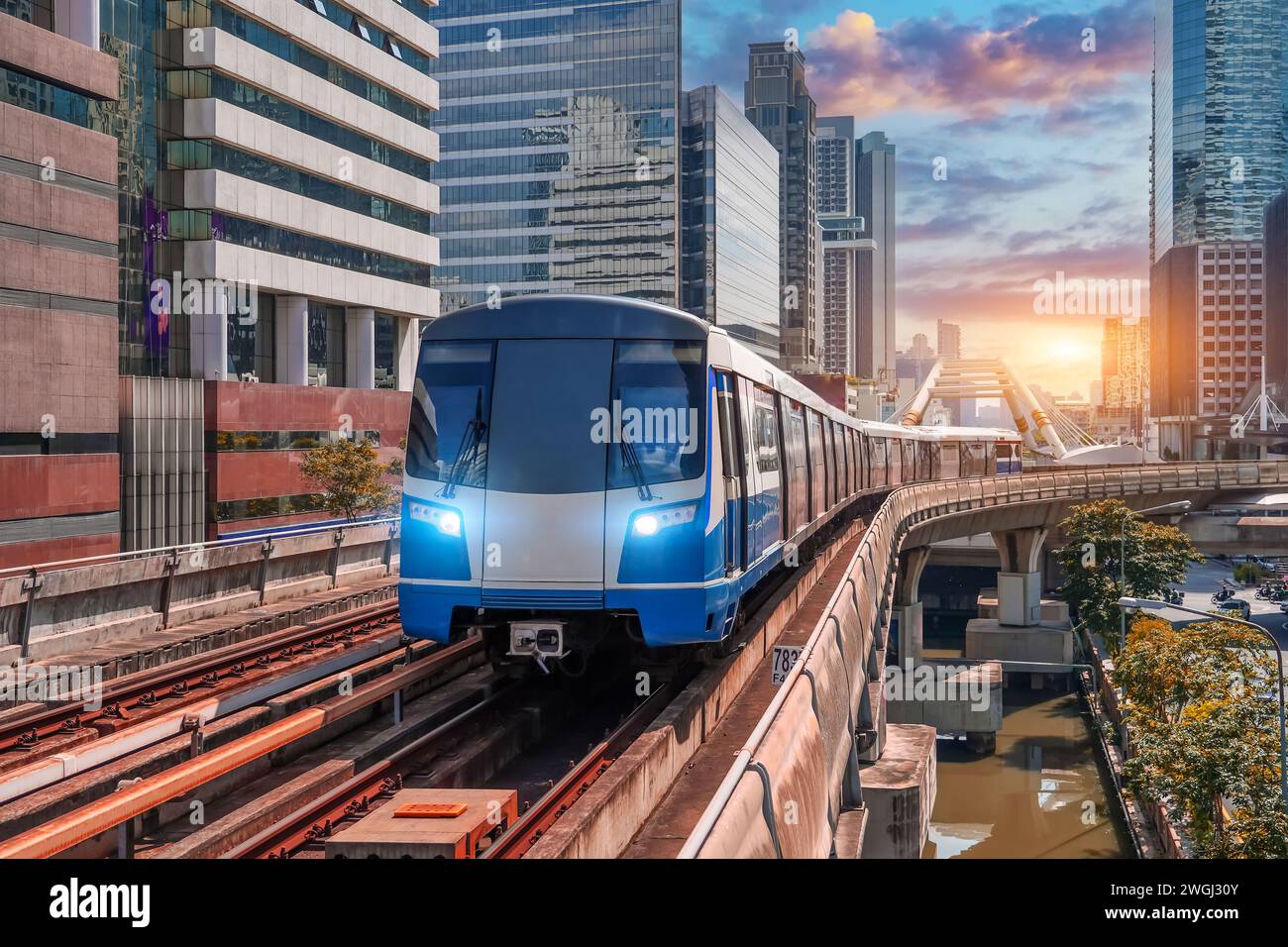 Electric train bright light railway carriage rushes turn travels along ...