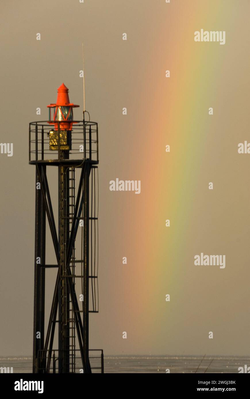 Colorful rainbow over lighthouse and beach Stock Photo - Alamy