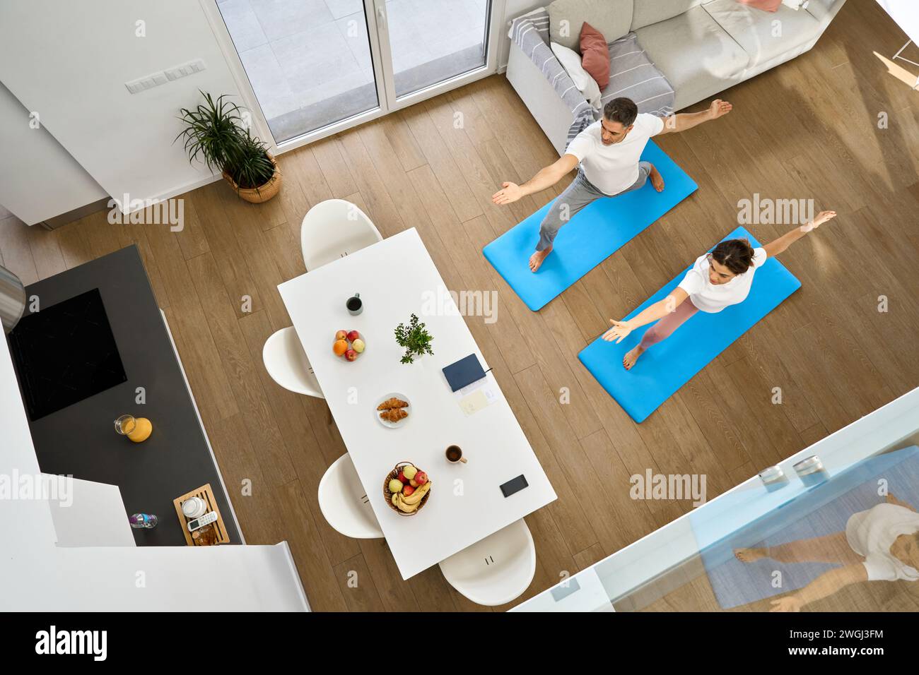 Top view from above of middle aged couple doing yoga at home Stock ...