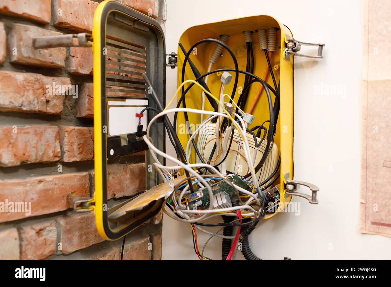 A switchboard with an electrical connecting cables and wi-fi router box ...