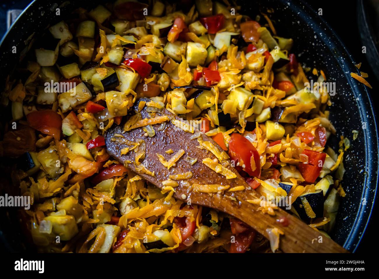 savory aroma of ratatouille wafting from the chef's pan on the stove ...