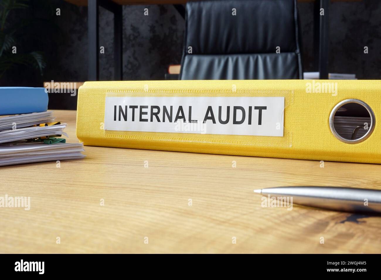 Folder with label Internal audit and notepads Stock Photo - Alamy
