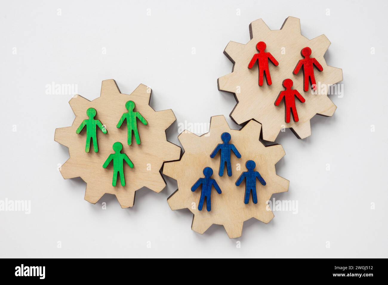 Gears and figures as a symbol of teamwork and collaboration Stock Photo ...