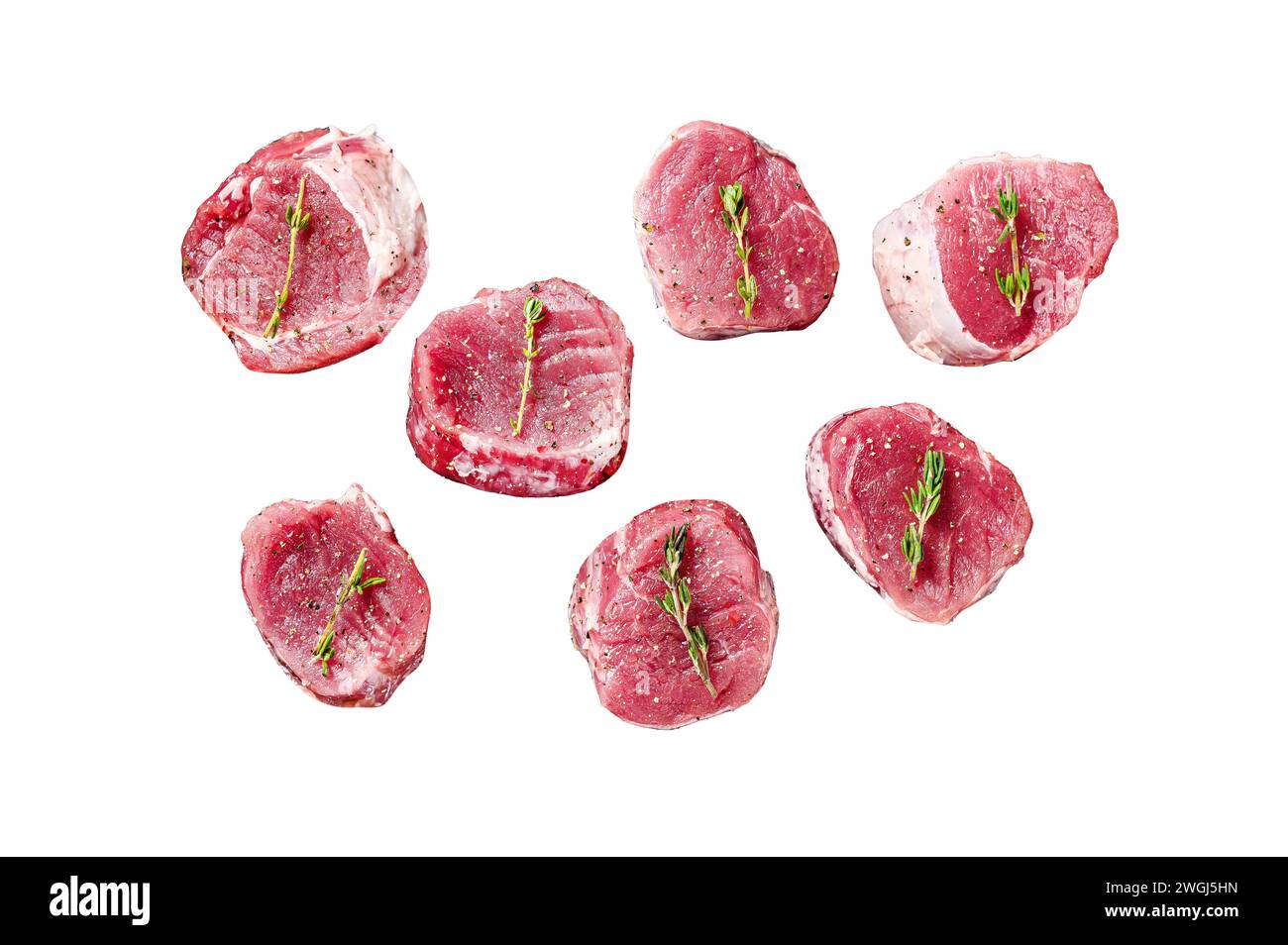 Raw pork medallion steaks with pepper and thyme. Isolated on white ...