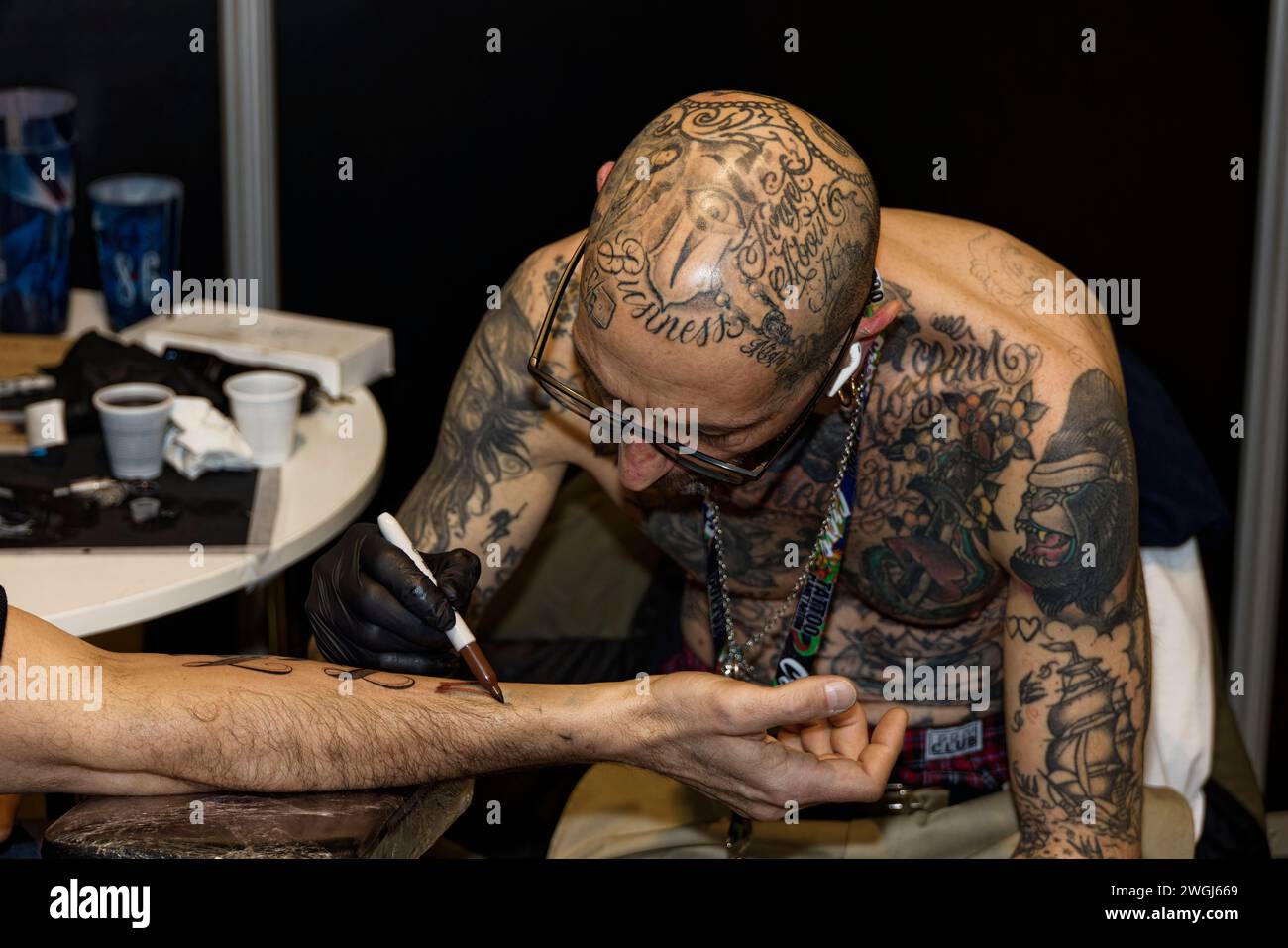 Paris, France. 3rd Feb, 2024. Tattoo artist, Brigante (Italy) during ...