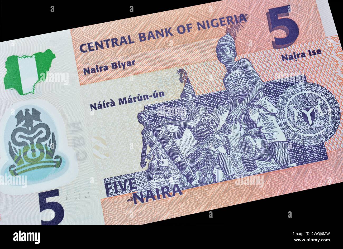 Reverse of 5 Naira banknote printed by Nigeria, that shows Drum Players and Nigerian flag Stock ...