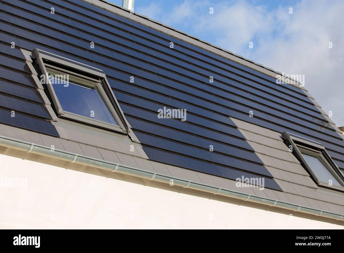 Detached house with solar roof tiles as a high-quality and attractive ...