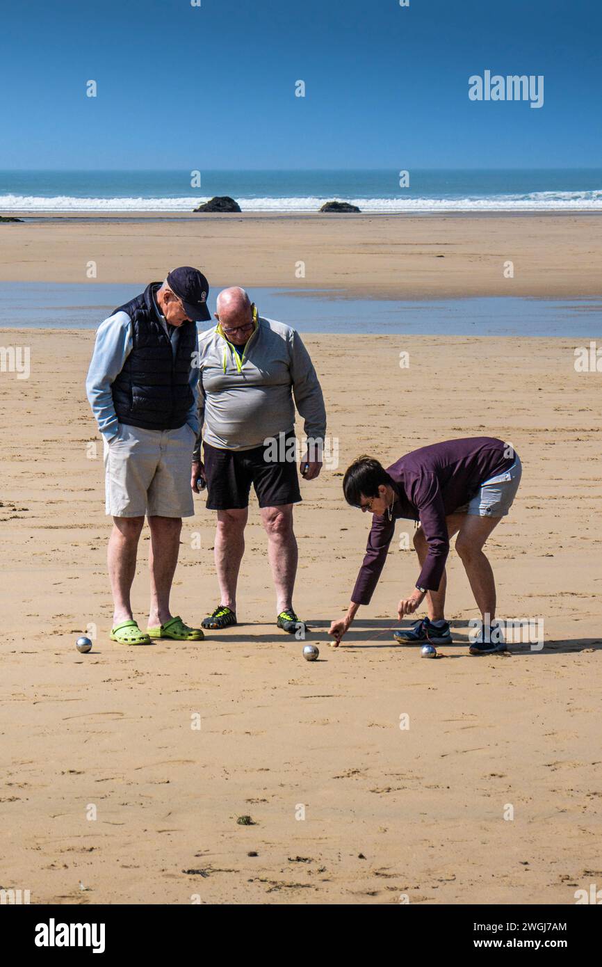 Holidaymakers playing Boules Pétanque on Mawgan Porth beach in Cornwall ...