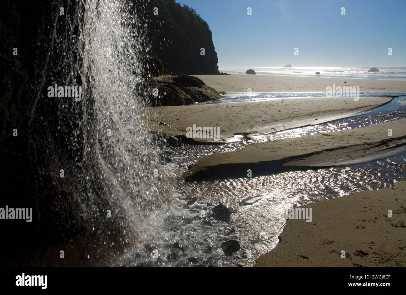Beach waterfall, Hug Point State Park, Oregon Stock Photo - Alamy